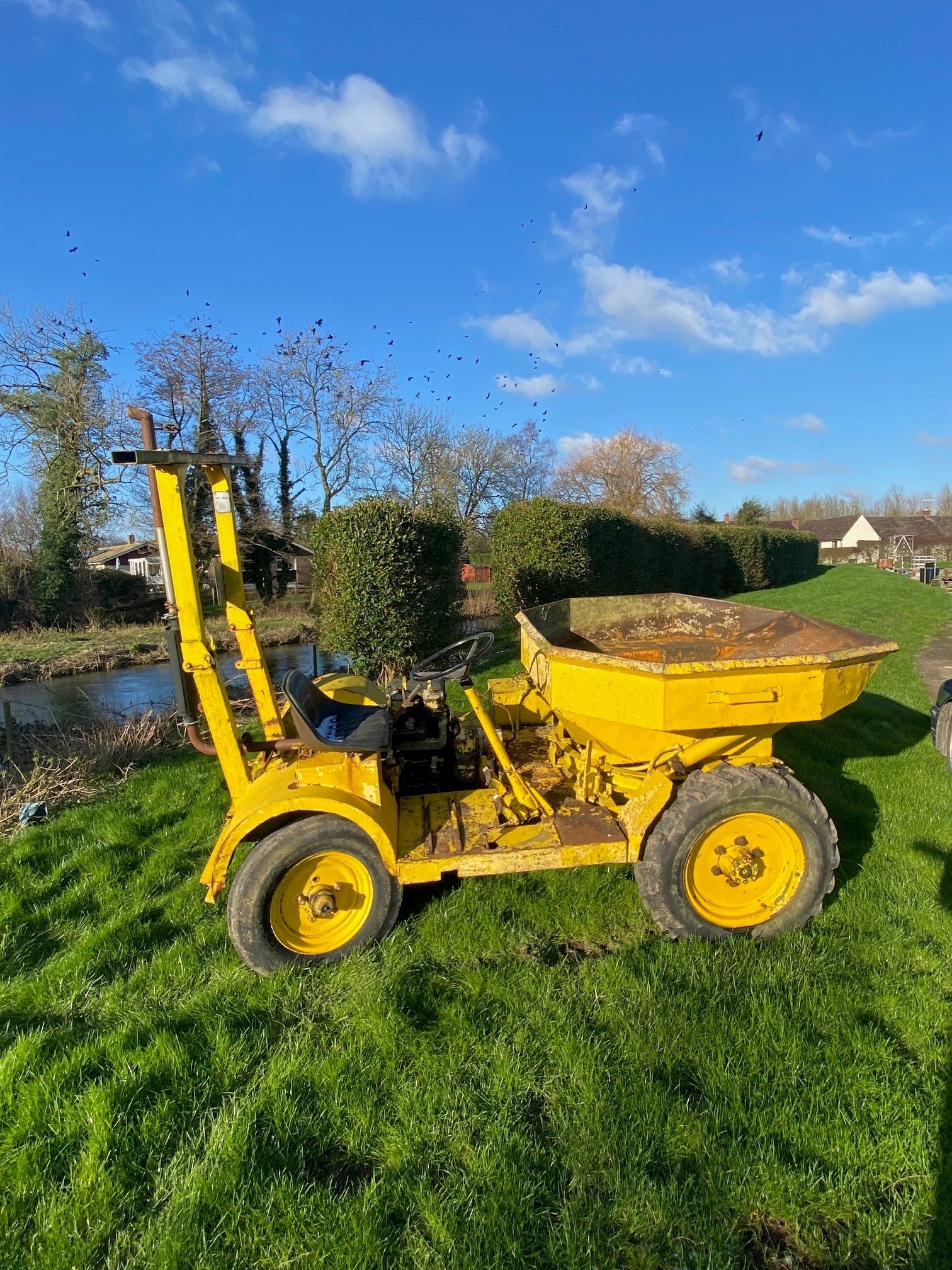 Winget 2 ton swivel dumper. Runs and drives, hard to start in winter ...