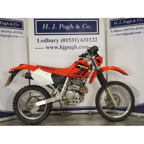 Honda XR250R motocross bike. 249cc. 2002. Runs and rides. Showing low ...
