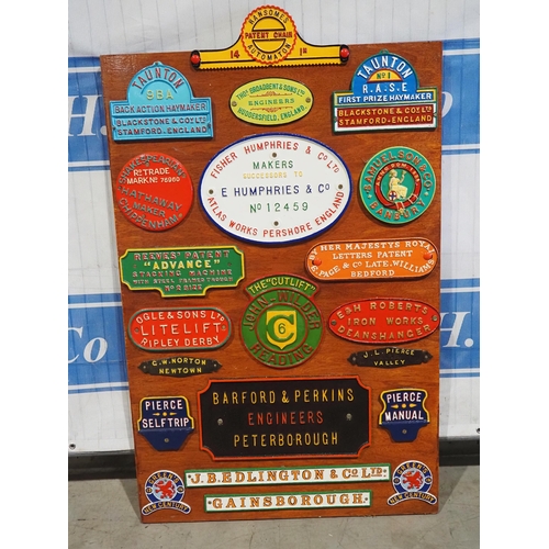 Display board of assorted cast iron name plates to include Ransomes ...