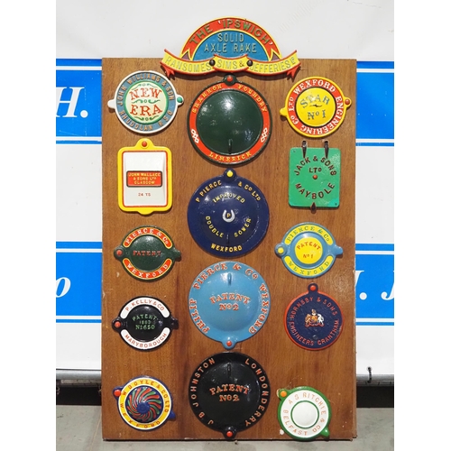 Display board of assorted cast iron name plates to include Ransome's ...