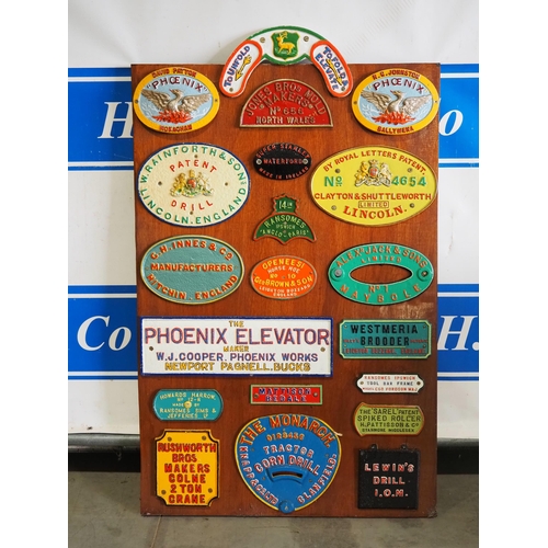 Display board of assorted cast iron name plates to include Phoenix ...