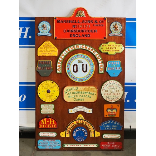 Display board of assorted cast iron name plates to include Marshall ...