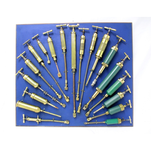 Wall Art display of vintage grease guns to include Warts, Enots Wad ...