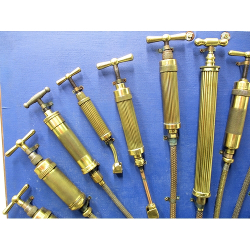 Wall Art display of vintage grease guns to include Warts, Enots Wad ...