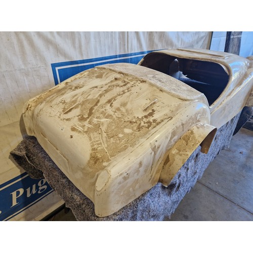 Fibreglass body shell of a model Triumph car 74" x 36"