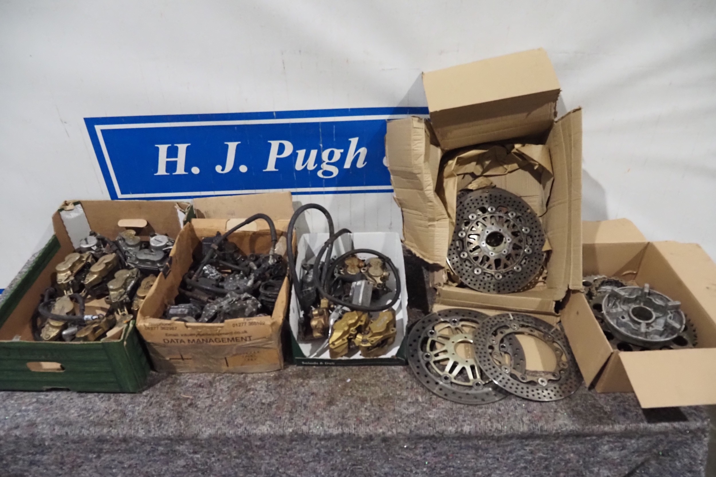 Various motorcycle brake discs, sprockets, brake calipers, etc.