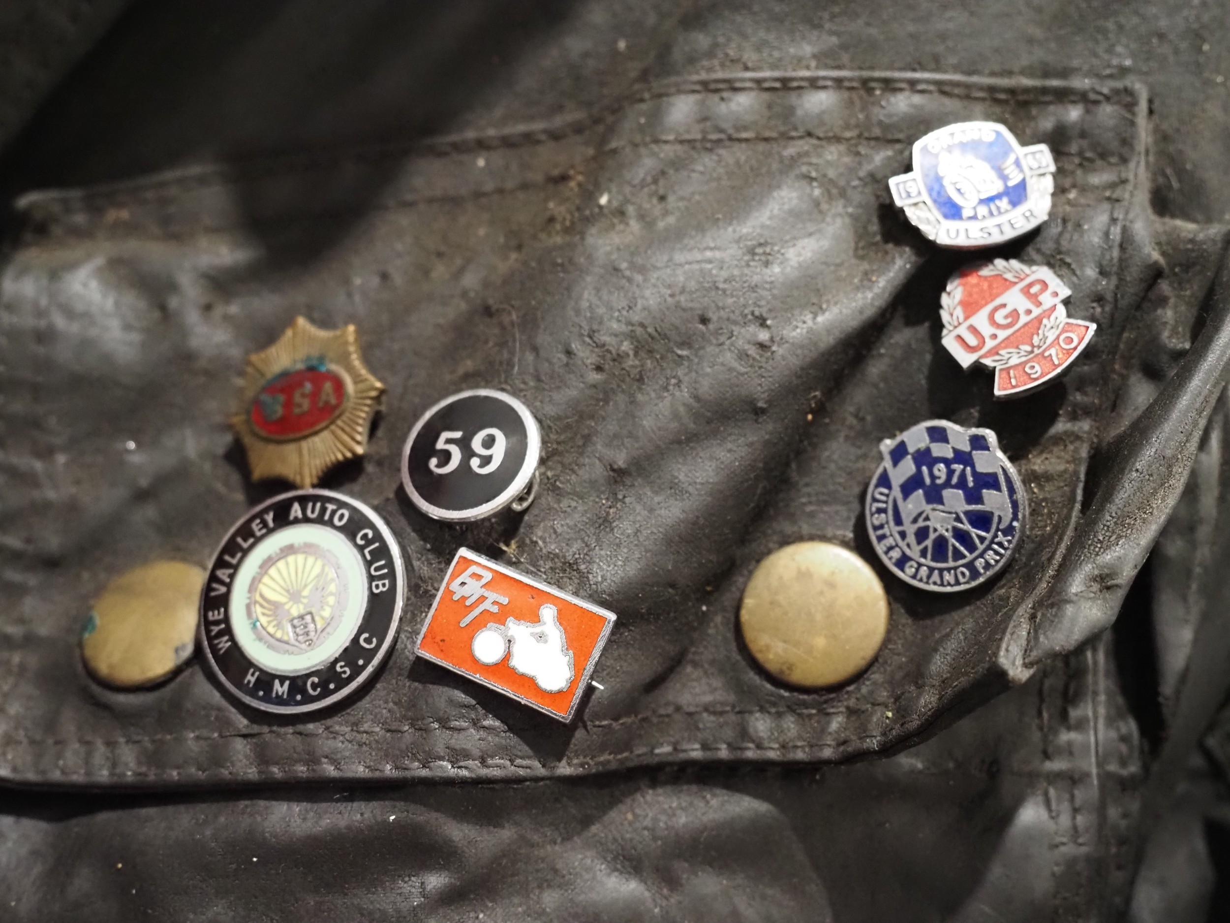 Barbour wax jacket with assorted motorcycle cloth badges and pin badges ...