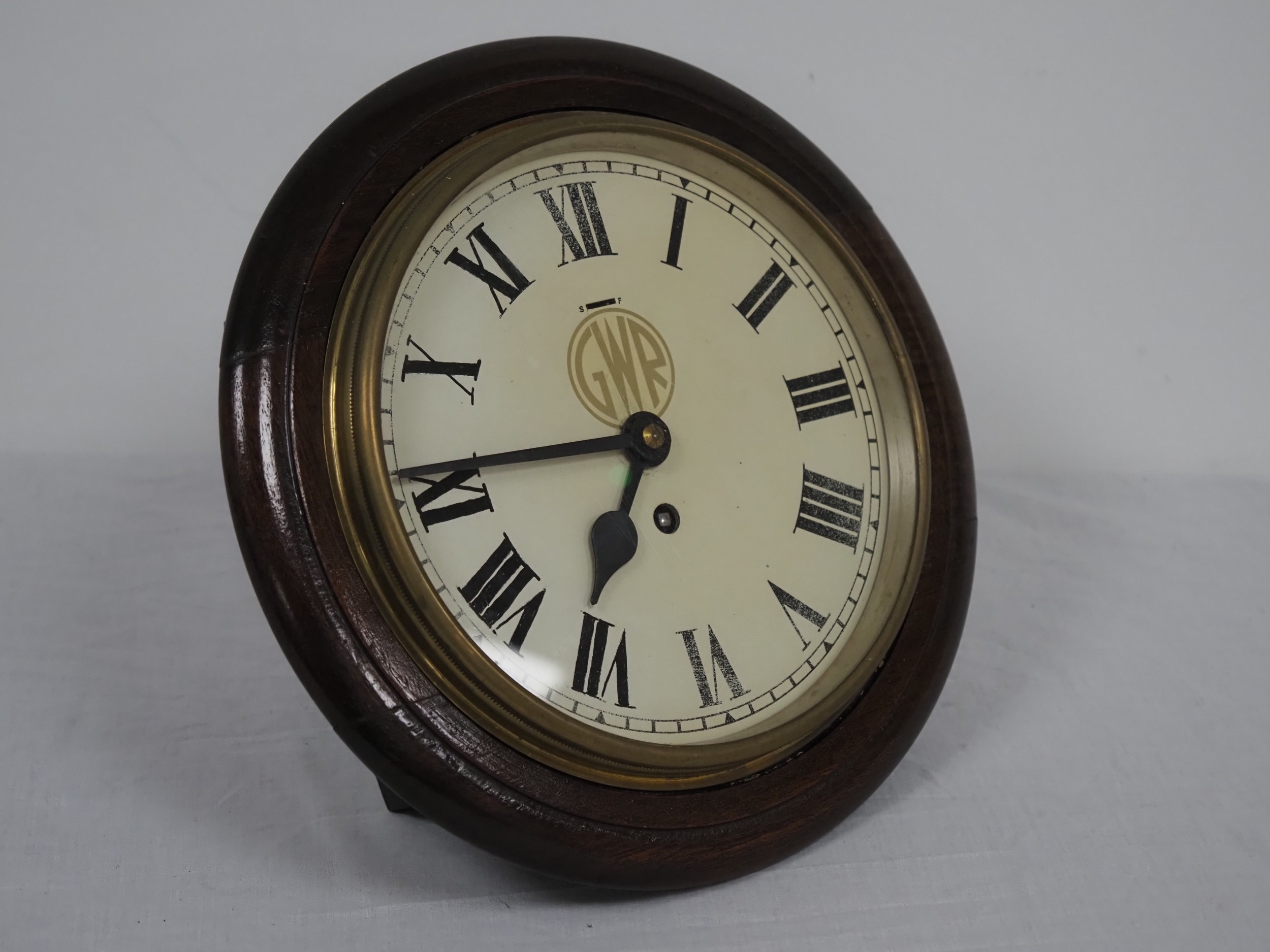 Oak and brass case wall clock with GWR logo and 8" dial