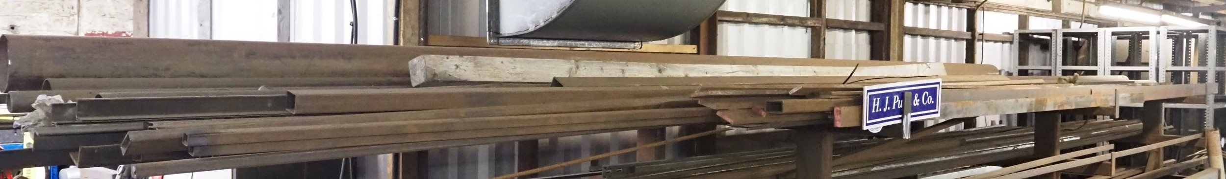 Quantity of mild steel of various size and length on racking