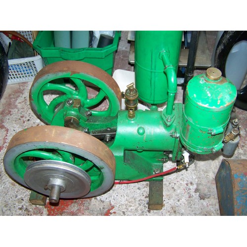 Small open crank gas/petrol engine, maker unknown. The exhaust valve is ...