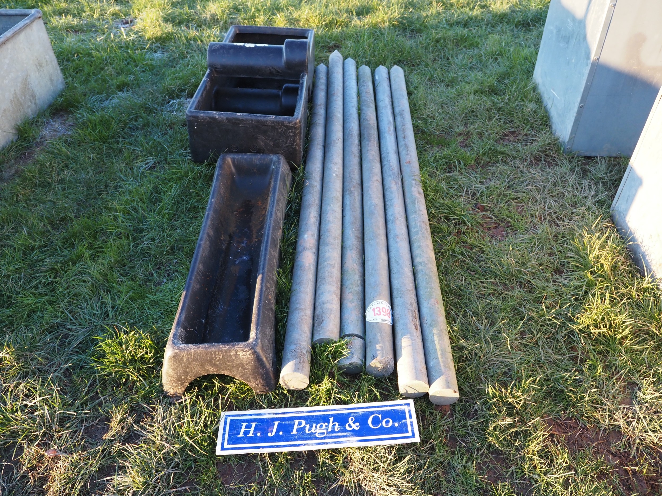 Black plastic water tank, trough and stakes