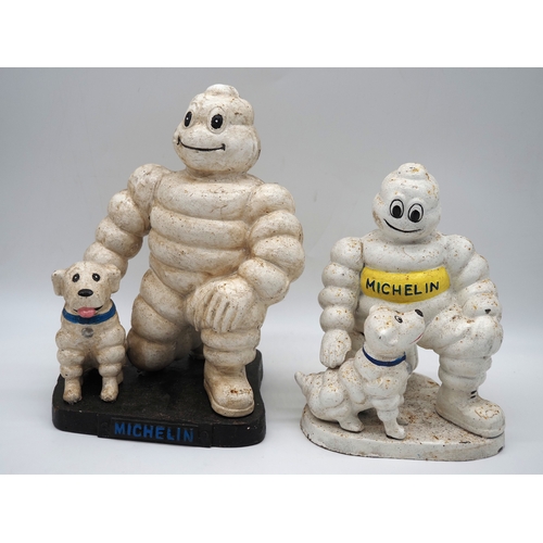 Cast iron Michelin man with dog 10" and 8"