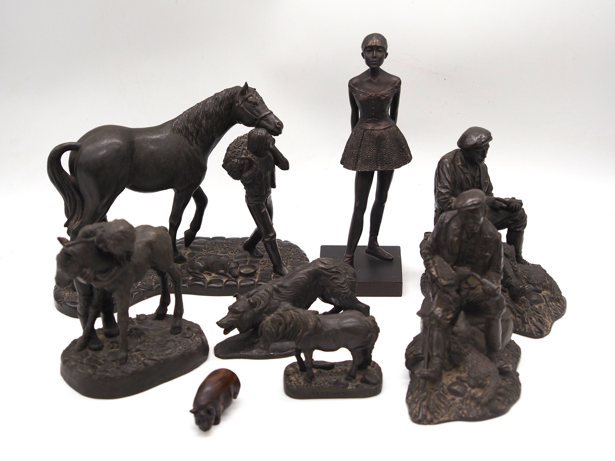 Assorted resin sculptures of humans and animals