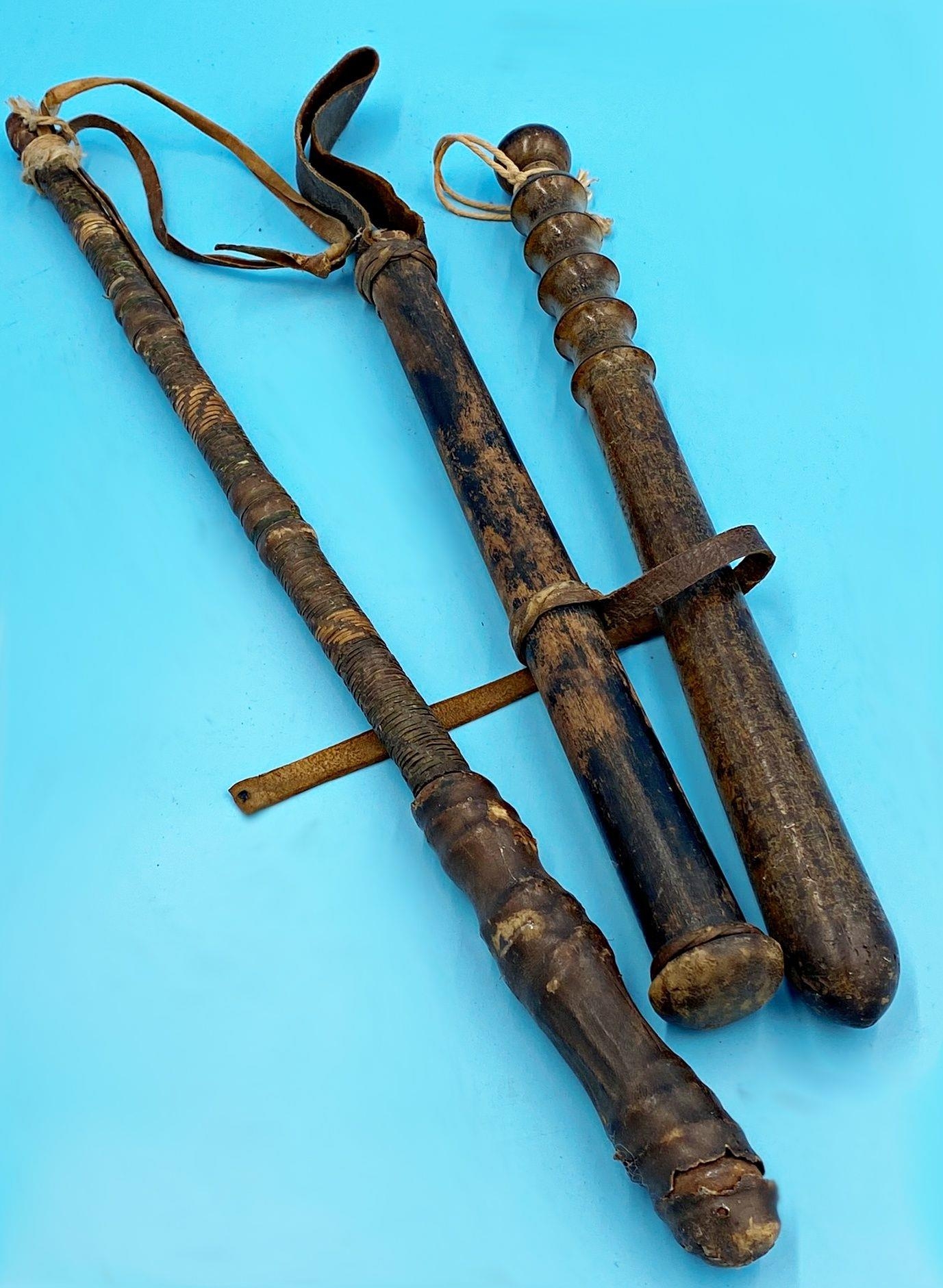 Antique lacquered police truncheon, with a further truncheon type baton ...
