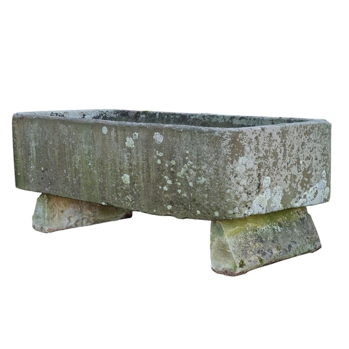 Large antique weathered carved natural stone trough raised on a pair of ...