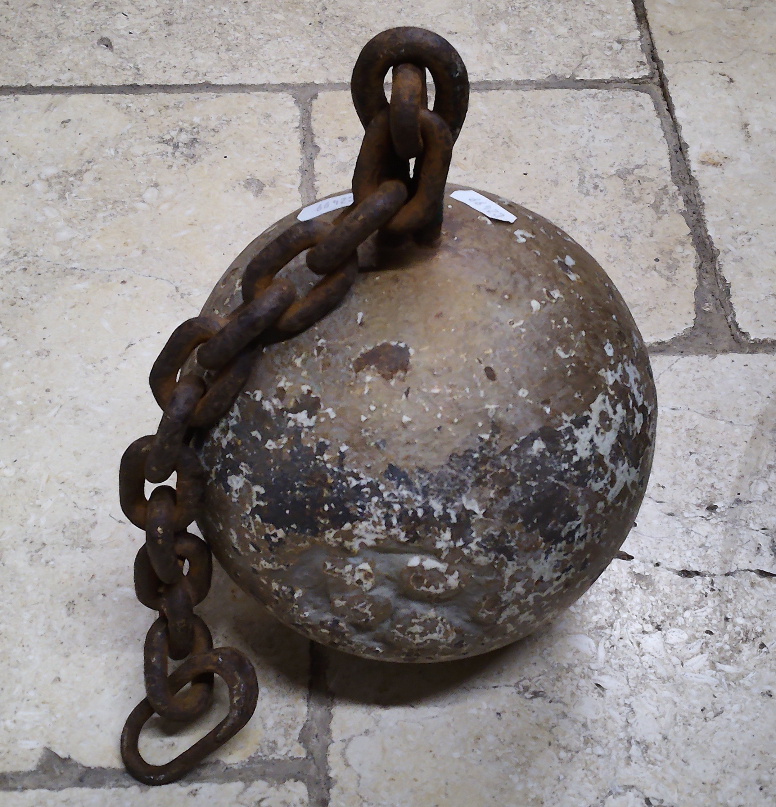 Heavy ball and chain, possibly from a shackle or cannonball