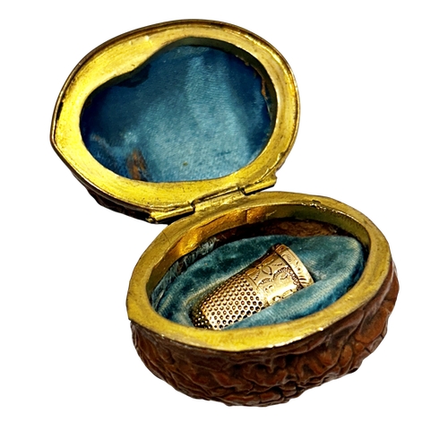 A 19th century walnut thimble case and a gold thimble, the thimble ...