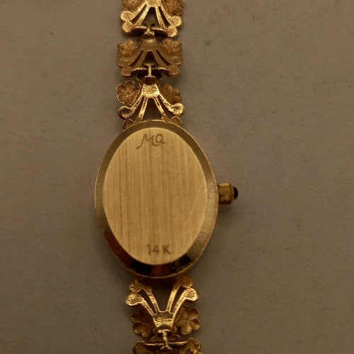 A Michael Anthony 14k gold ladies wrist watch 15g