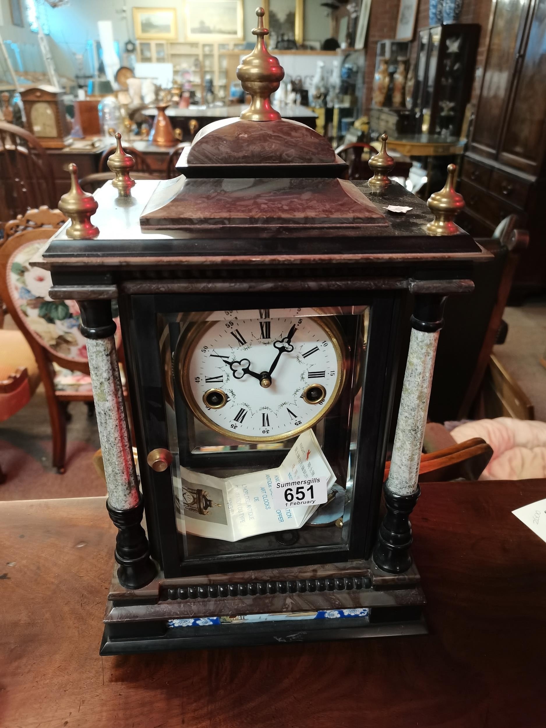 Knight brand mantle clock with highly decorative enamel face and pendulum