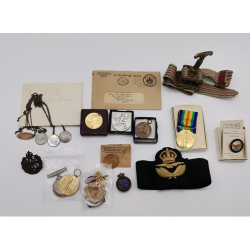 A small assorted collection of militaria and medallions, including two ...