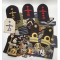 An assorted collection of military shoulder boards, rank slides, cloth ...