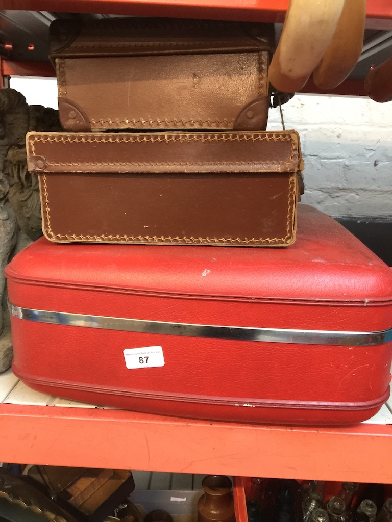 Two vintage cases and an Antler case.