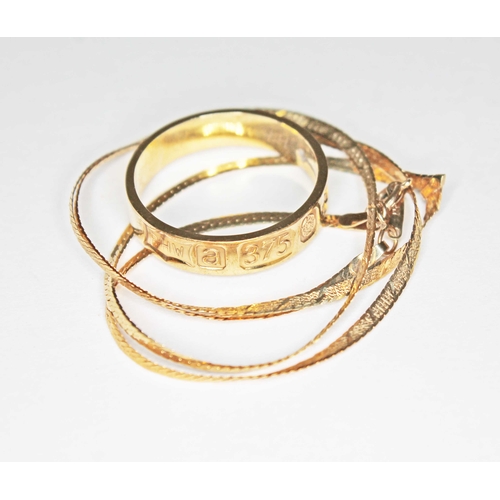A hallmarked 9ct gold ring and chain marked with 9ct gold import marks ...