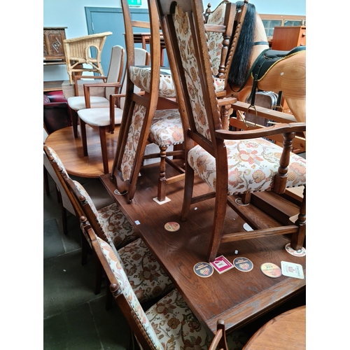 A Bevan Funnell Reprodux aged oak refectory table and 6 chairs.