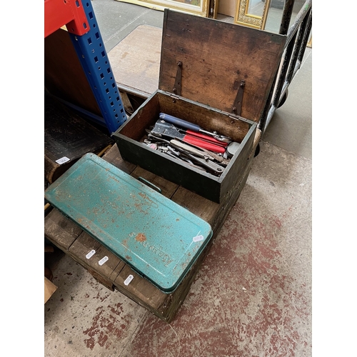 A joiner's toolbox with contents to include chisels, a socket set and a ...
