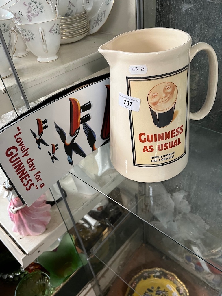 Two Guinness calendars and a Guinness jug.