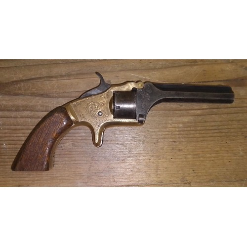 A late 19th century 5mm 7 shot revolver, length 17.5cm.