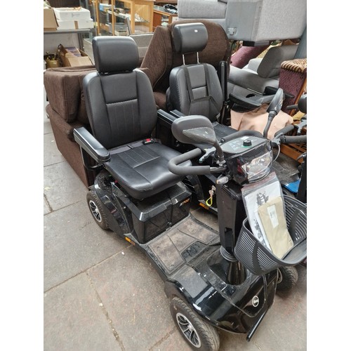 A Sterling S series mobility scooter with charger, key and paperwork - AF.