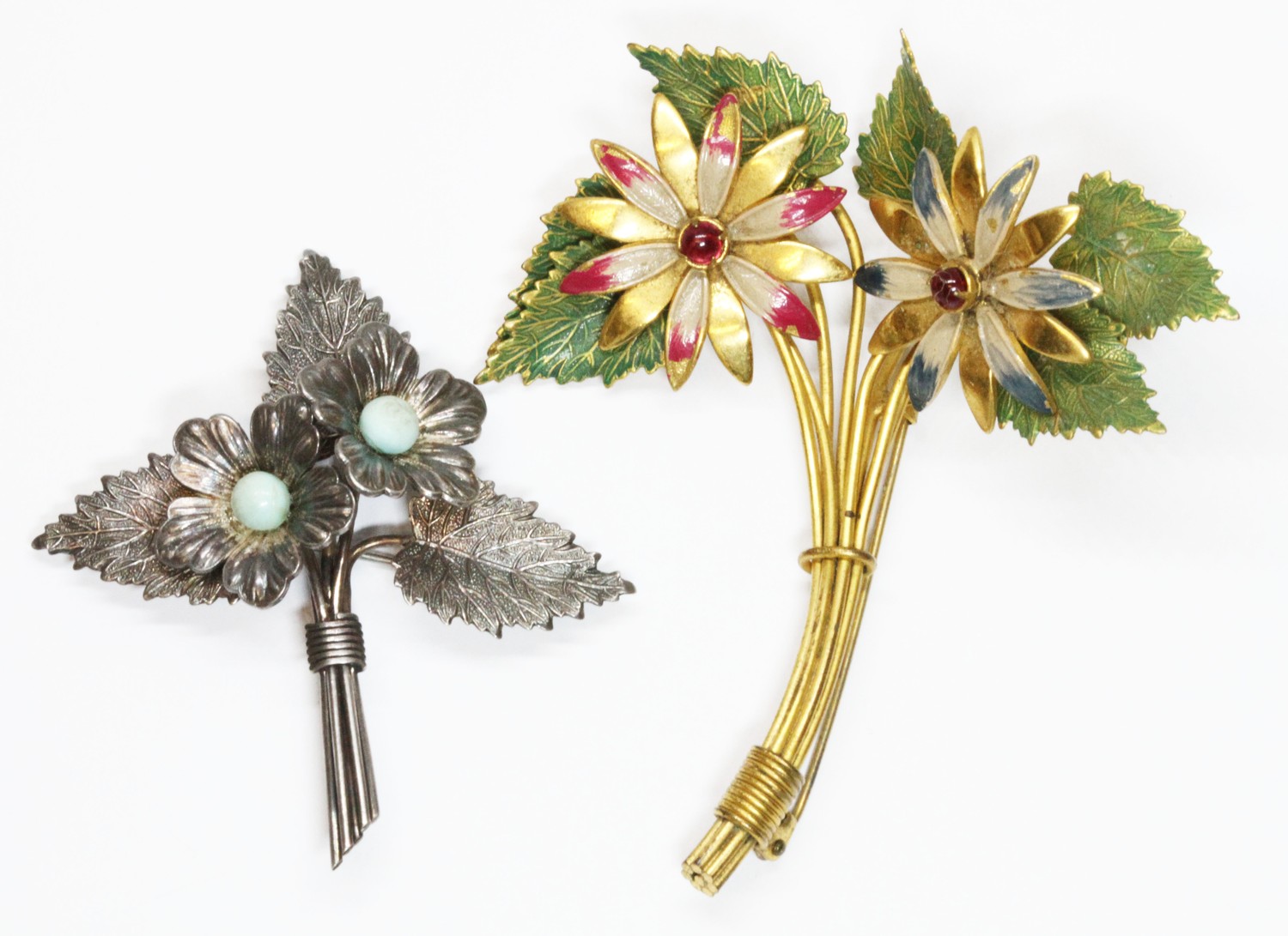 A Charles Horner silver brooch modelled as bound flowers and set with ...