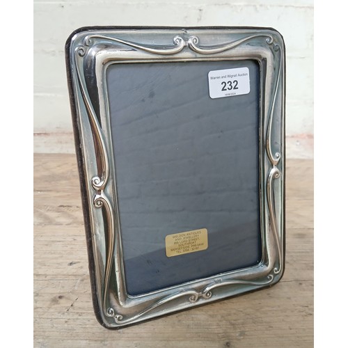 A silver photograph frame, sponsor 'KEld', London 1987, length 23.5cm.