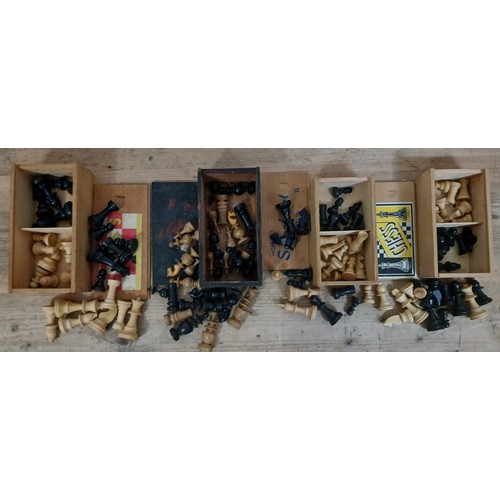A group of four wooden chess sets comprising three Staunton pattern and ...