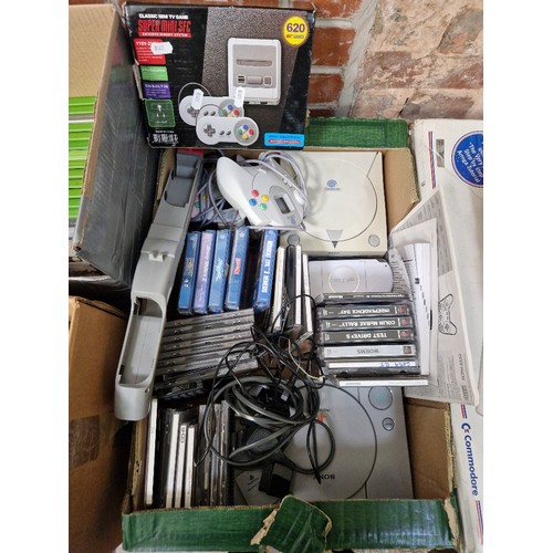 A box containing assorted computer consoles & games to include a ...