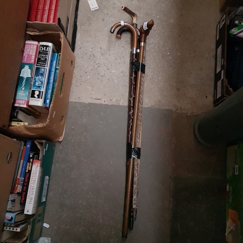 A bundle of six walking sticks including snakeskin, military swagger ...