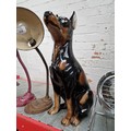 A large ceramic dog, approx. 50cm height.