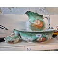A Victorian four piece washstand set including wash bowl, jug, lidded ...