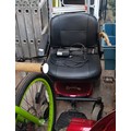 A Rascal P321 electric wheelchair with charger