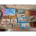 A box of model kits including Airfix, Frog, military vehicles, etc.
