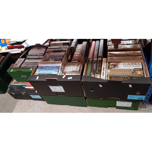Six boxes containing audio book cassette tapes and CDs and DVDs.