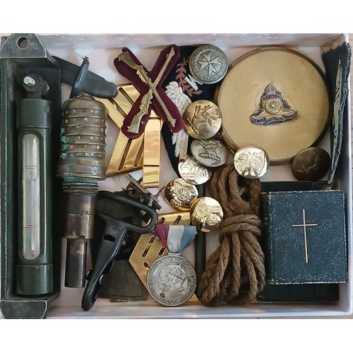 A box of assorted militaria including a French beehive fuse, buttons ...