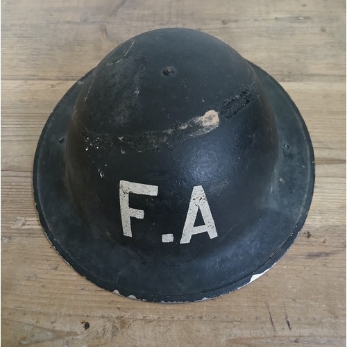A WWII Home Front Civil Defence First Aid helmet.