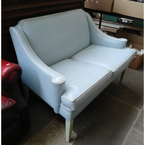 A Tetrad light blue leather two seater settee.