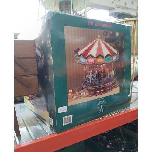 A handmade wooden carousel and an electric marquee grand carousel.