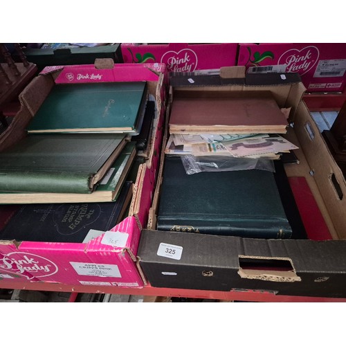 Two boxes of stamp albums containing World stamps, etc.