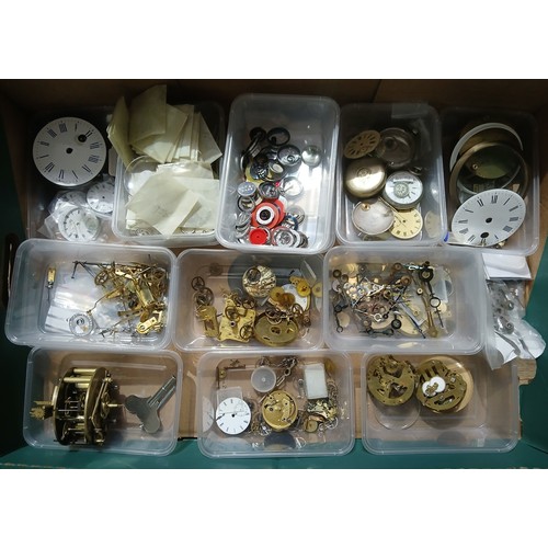 A box of assorted watch and clock spares.