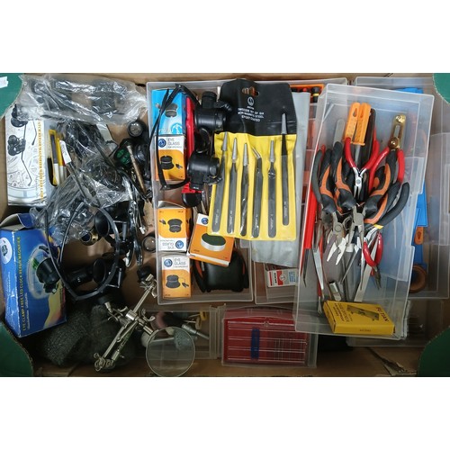 A box of assorted horology tools.