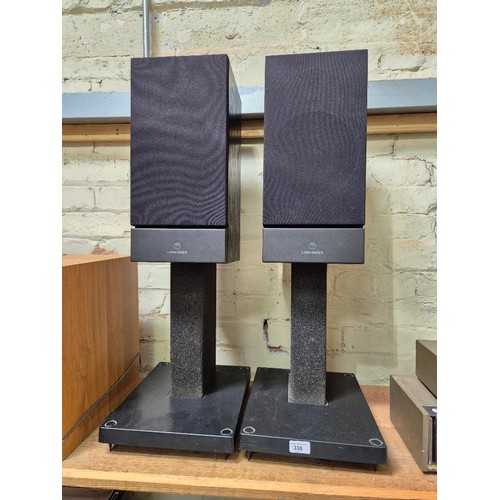 A pair of Linn Index speakers on stands.